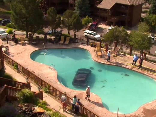 Motorist drives into Colorado Springs swimming pool