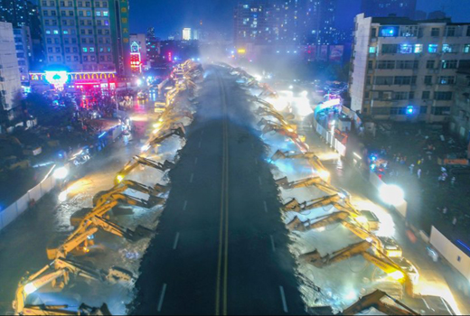 Amazing footage shows hundreds of diggers remove flyover in single night