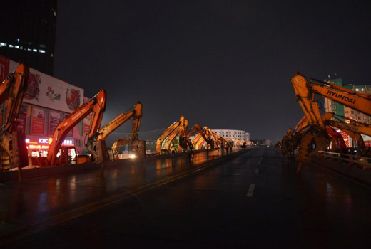 Amazing footage shows hundreds of diggers remove flyover in single night