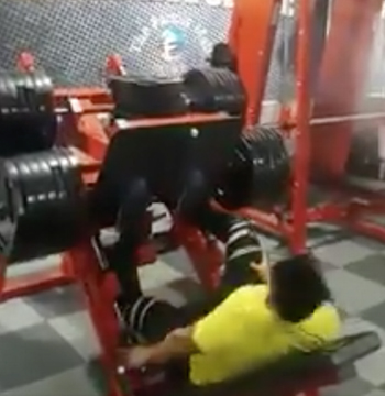 Horrific moment fitness fanatics leg bends backwards after pressing too ...