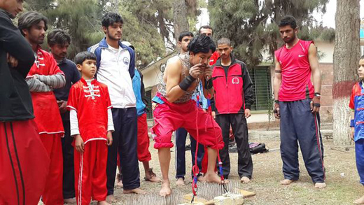 Fearless strongman lifts bricks with his EYELIDS while standing on ...